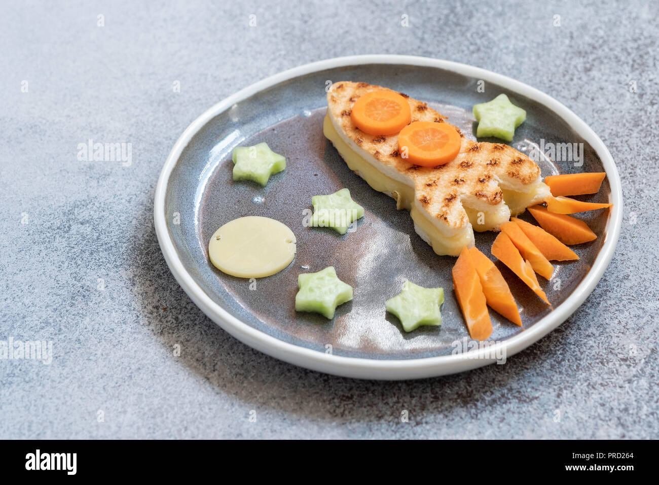 Grilled cheese sandwich look like rocket in a space Stock Photo - Alamy