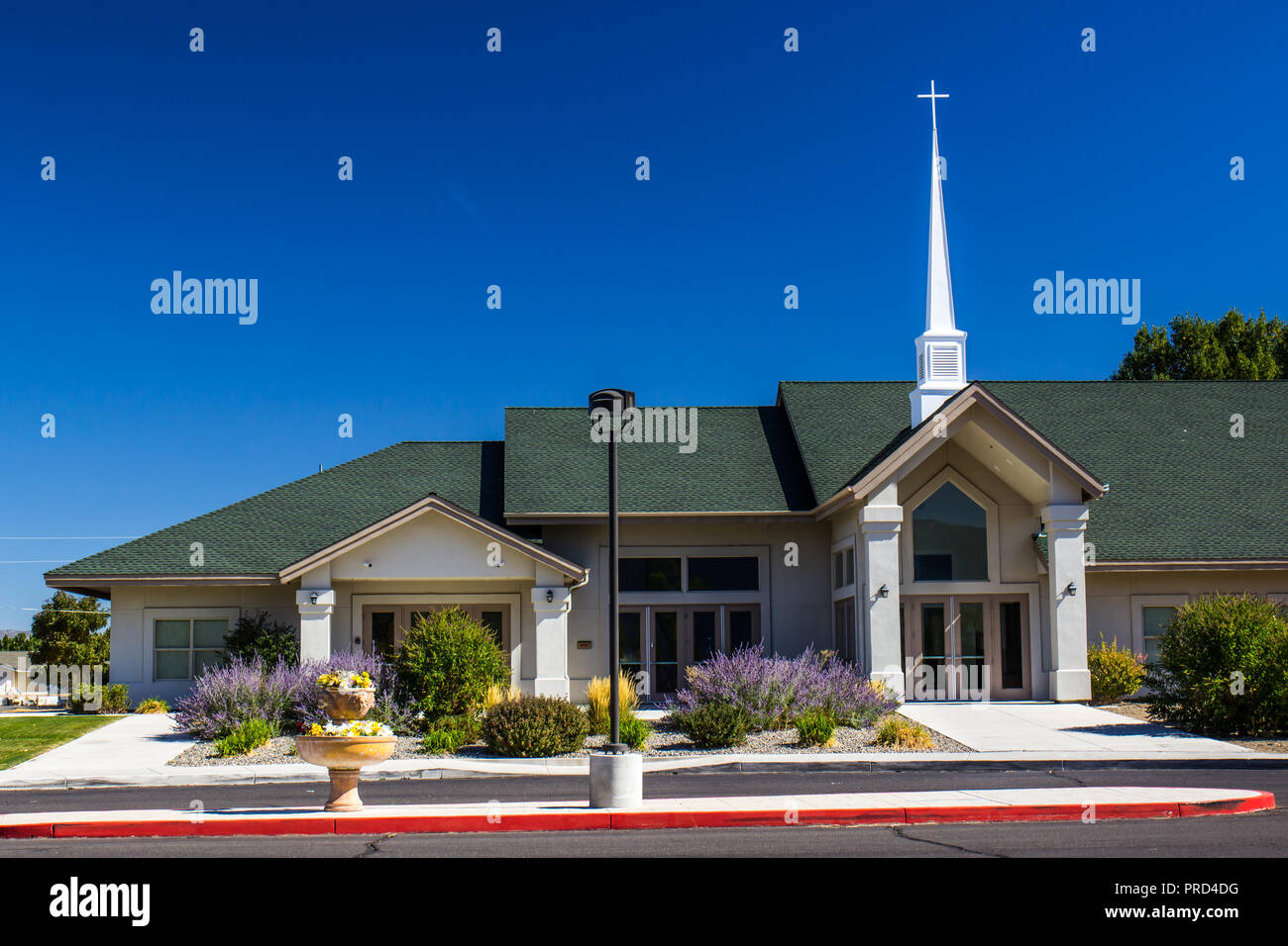Entrance To Modern Church with Steeple & Cross Stock Photo - Alamy