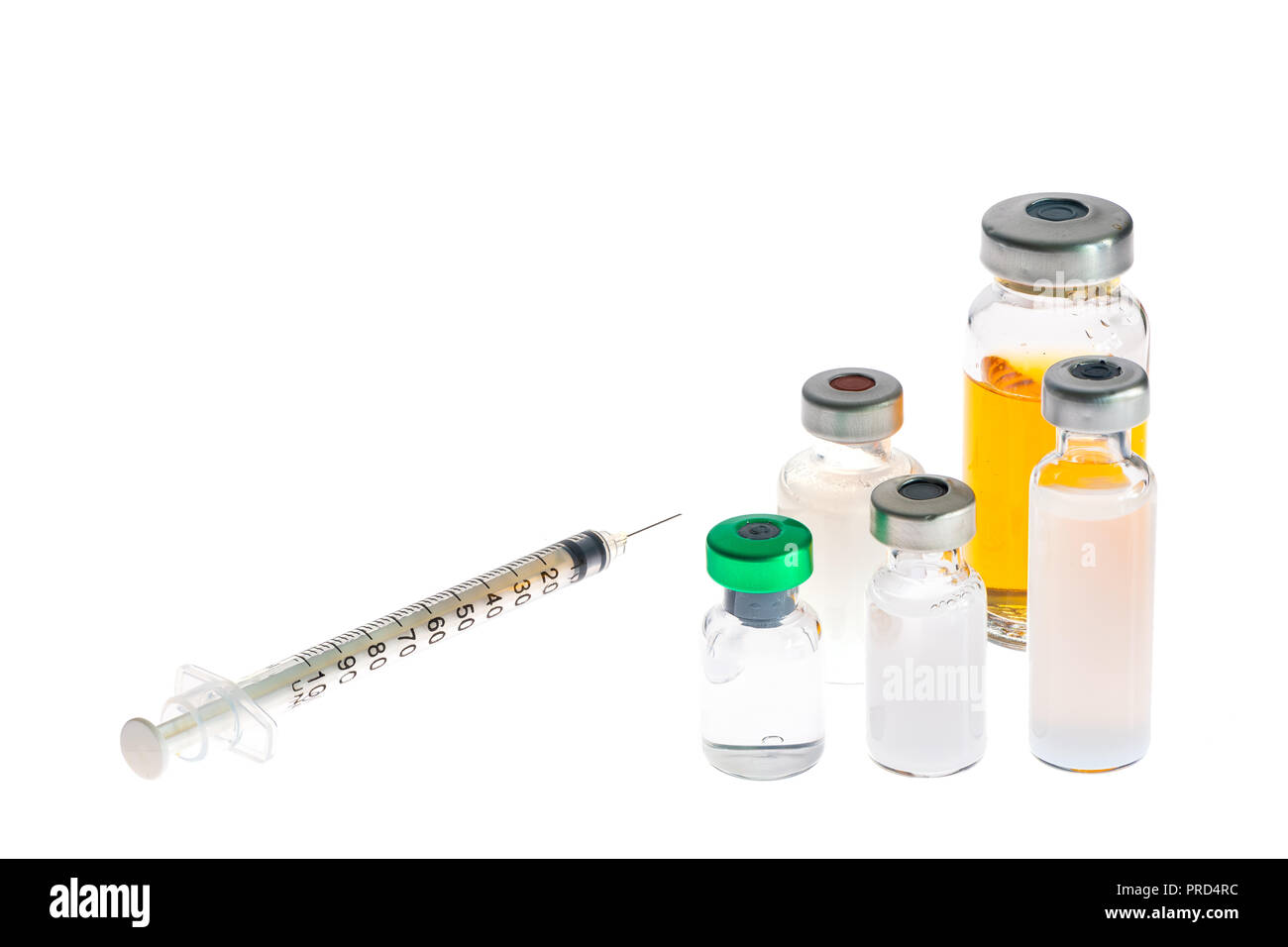 Various type of vaccine bottles and a small size syringe isolated on ...