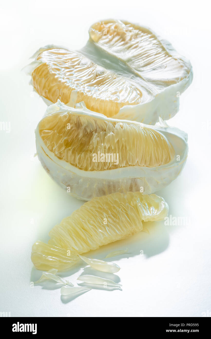 Peeled fresh pomelo isolated on white background Stock Photo - Alamy
