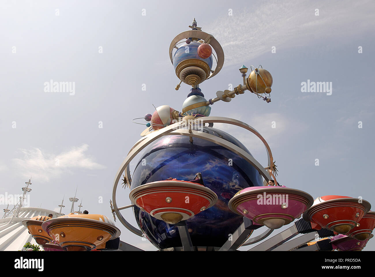 TOURIST ON THE "ORBITRON" RIDE AT TOMMORROWLAND AT HONG KONG DISNEYLAND ...