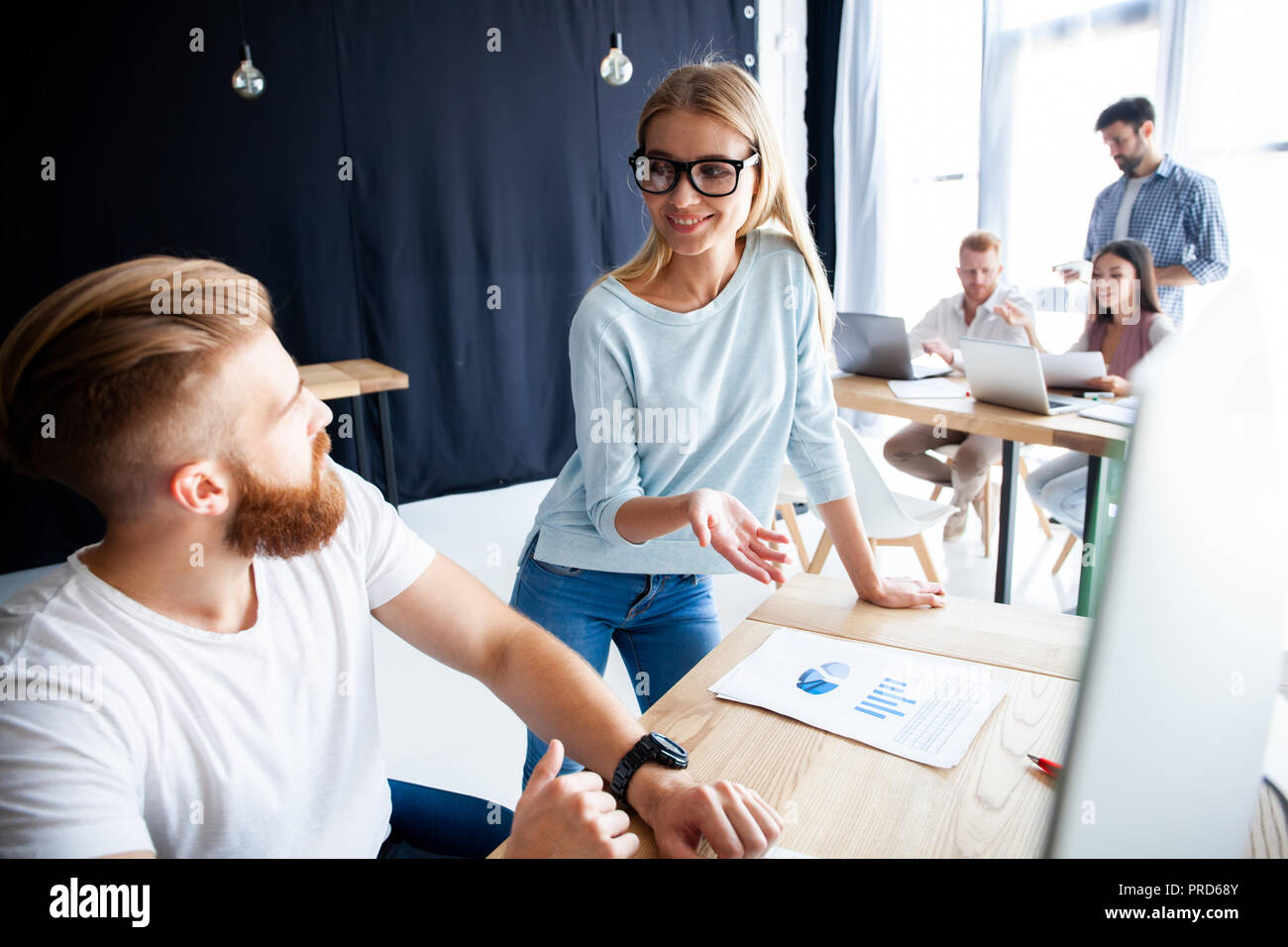 Confident and successful. Young modern colleagues in smart casual wear ...