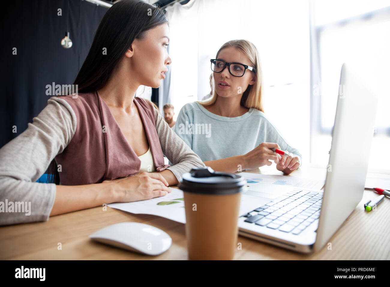Two female colleagues in office working together Stock Photo - Alamy