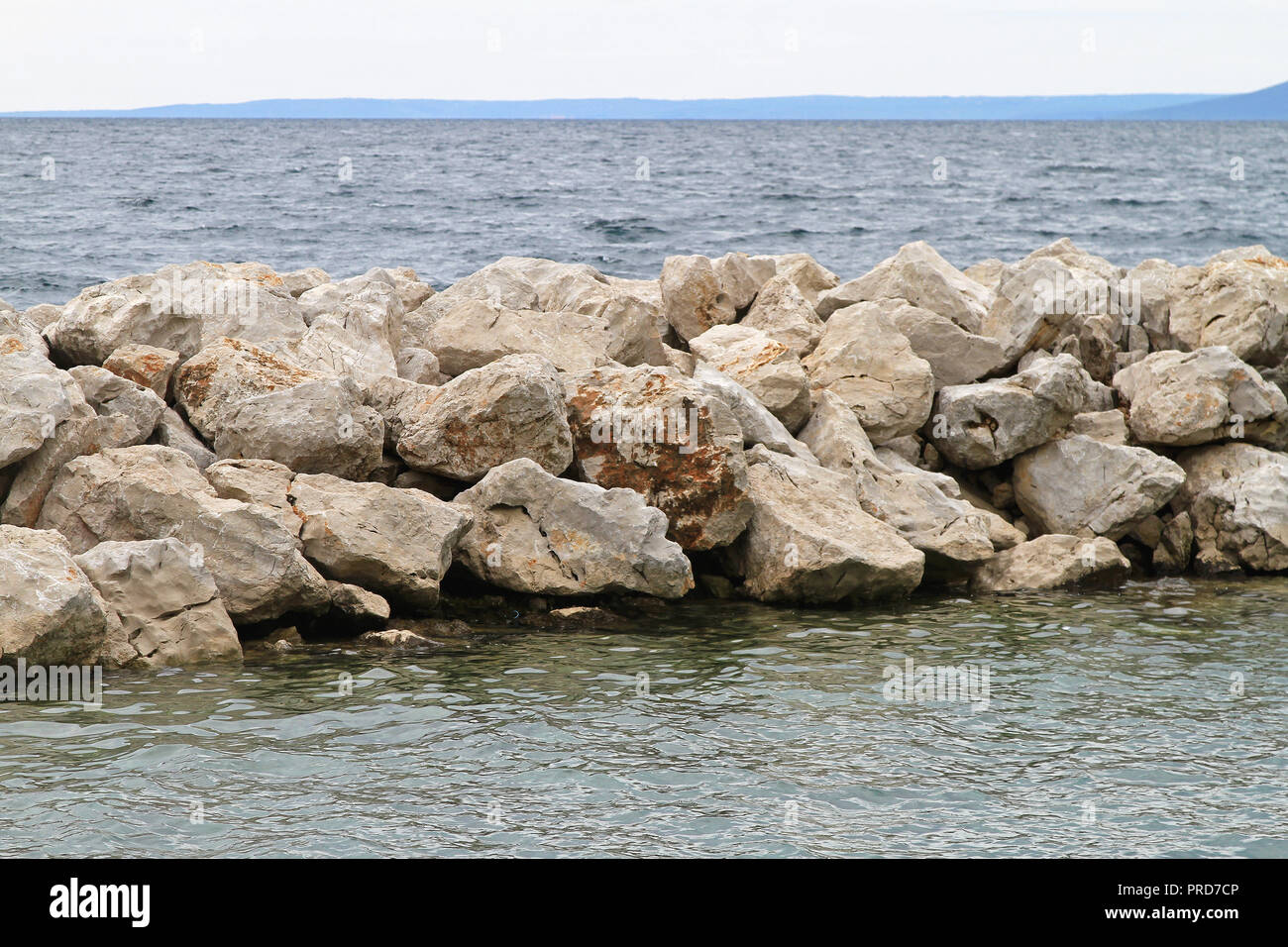 Breakwater stone structure for coastal erosion defense Stock Photo - Alamy