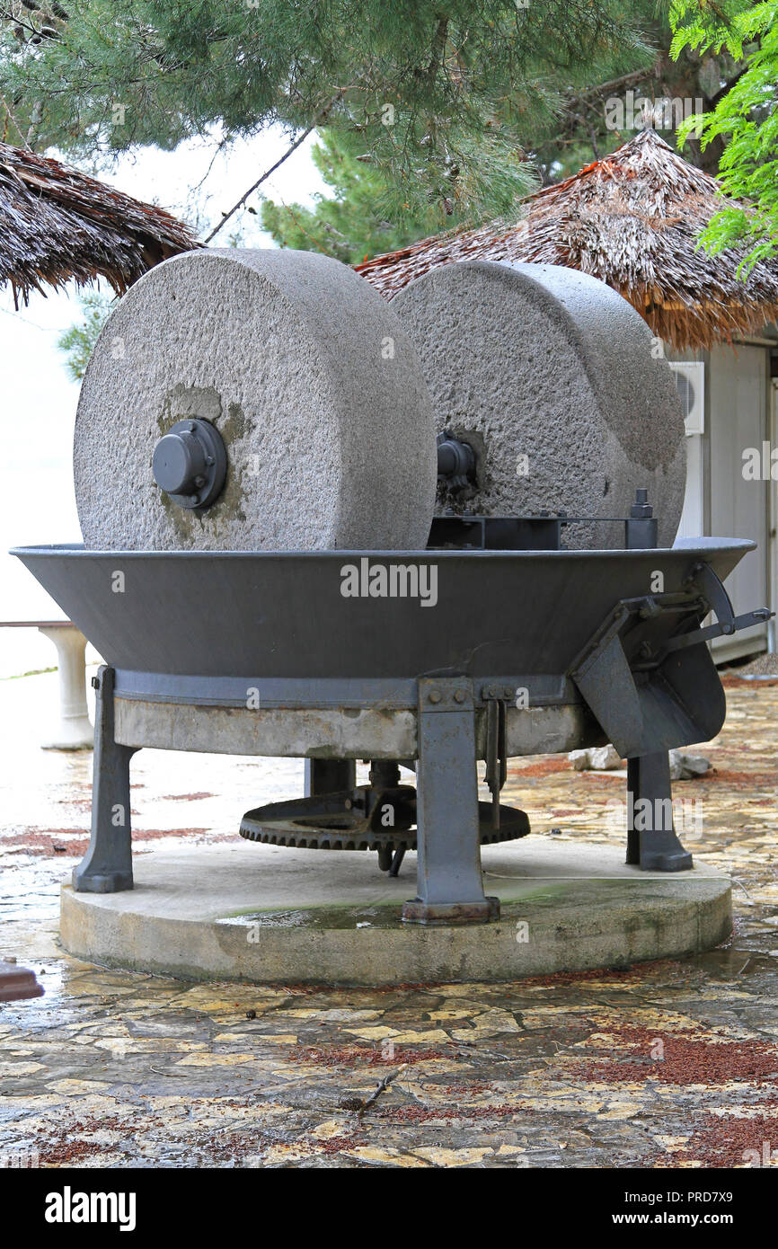 Medieval stone press for olive oil extraction Stock Photo - Alamy