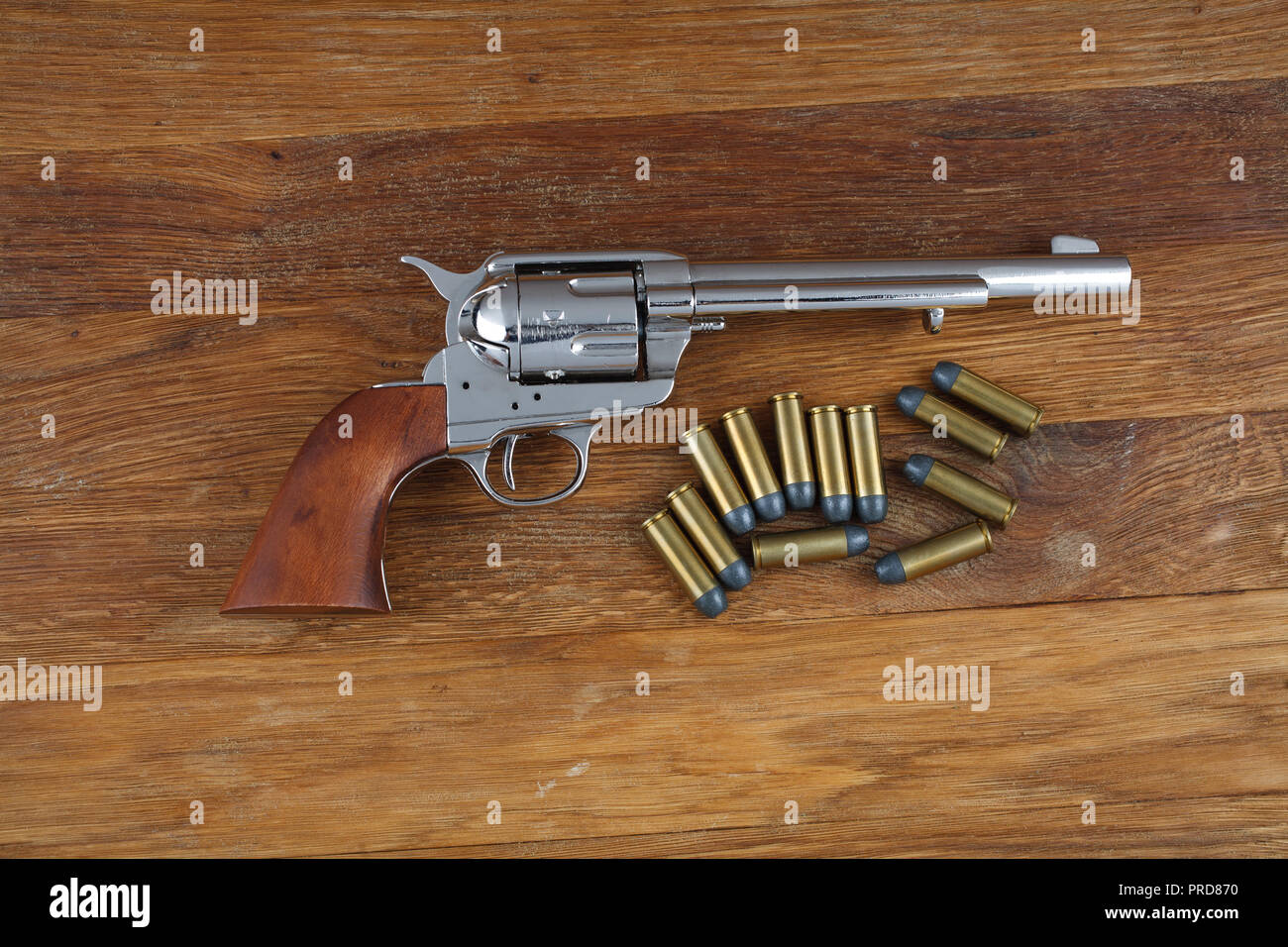 wild west revolver - colt single action army on wooden background Stock ...