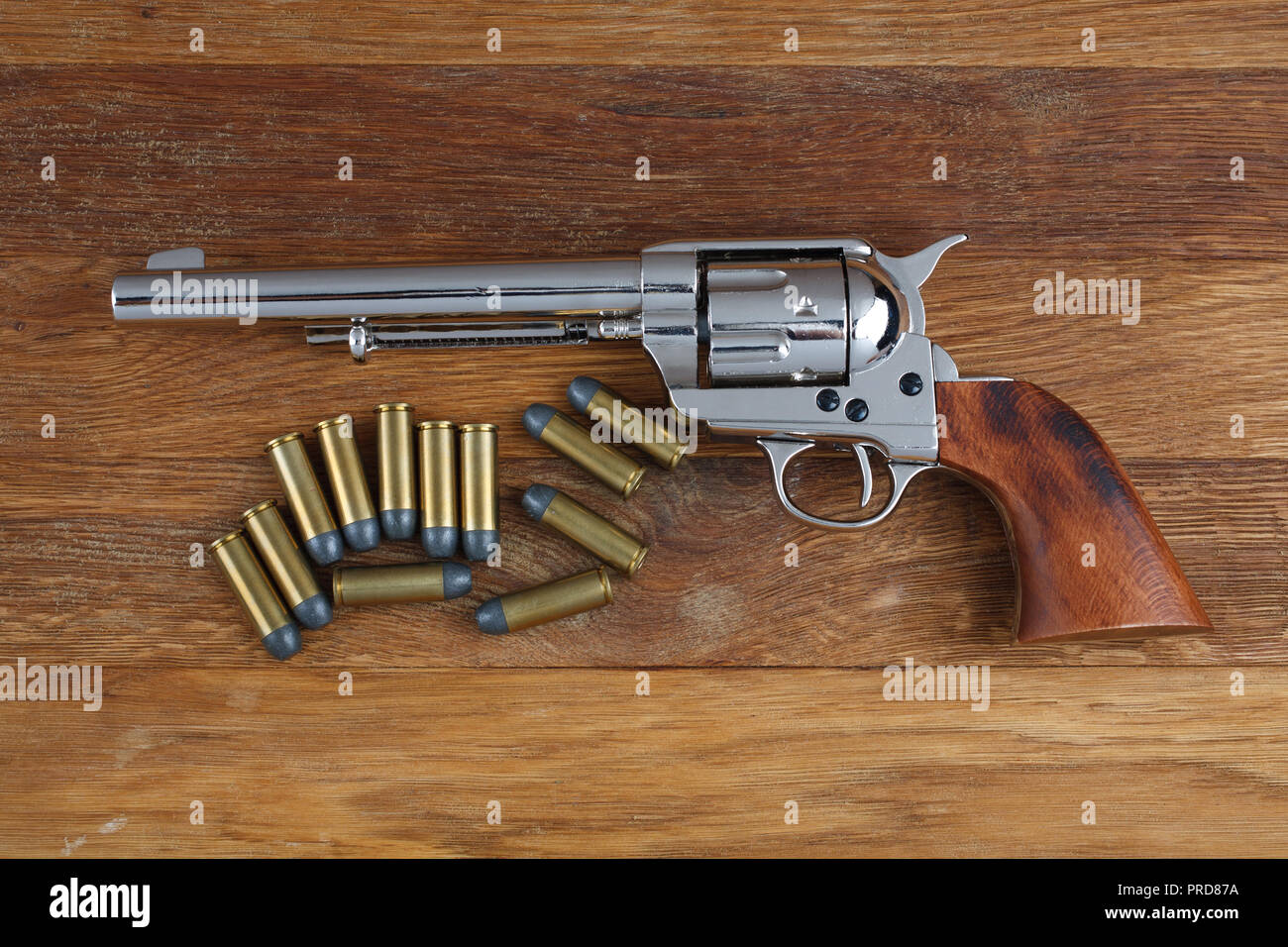 wild west revolver - colt single action army on wooden background Stock ...