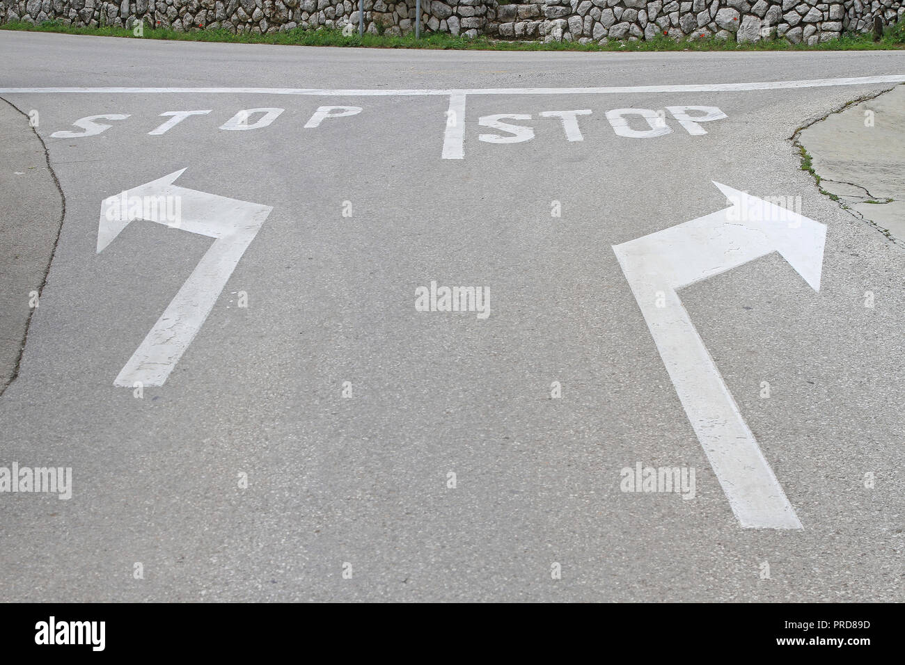 Two ways choice with arrows at intersection Stock Photo - Alamy