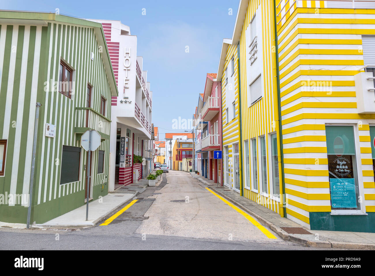 Street in the beach community of Costa Nova, with cute colorful striped ...