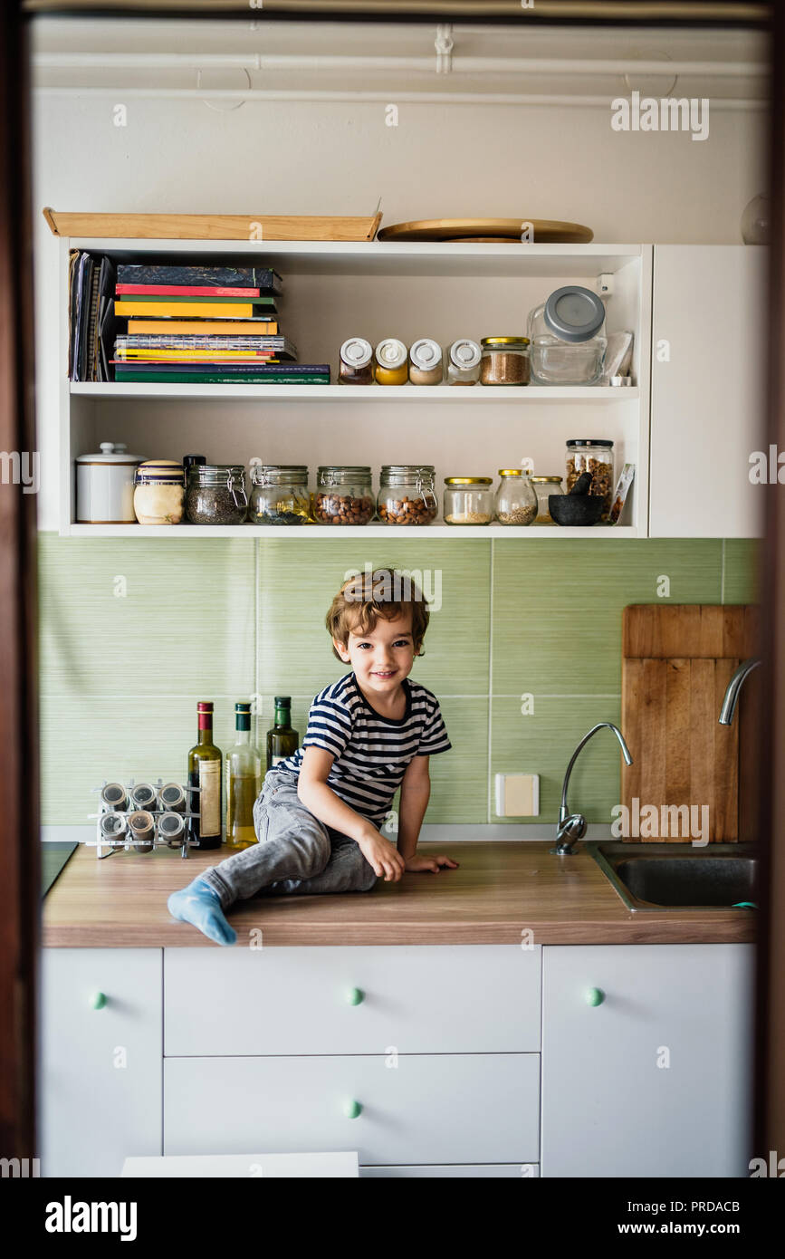 Little boy in his kitchen Stock Photo - Alamy