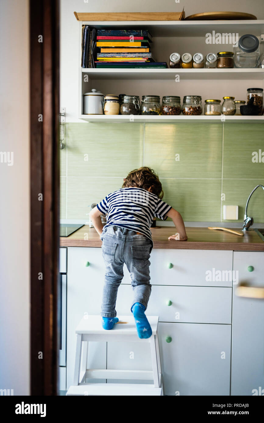 Toddler climb up ladder hi-res stock photography and images - Alamy