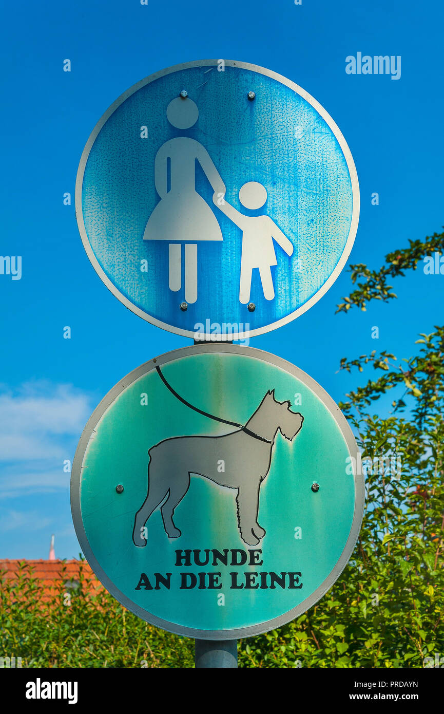 Mandatory signs, pedestrian path and dogs on a leash, Munich, Upper ...