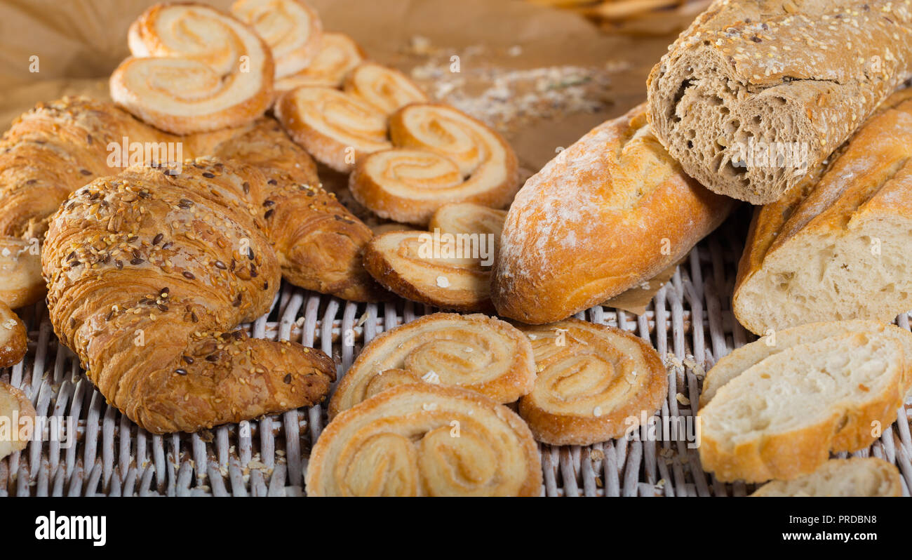 Image of various kinds of bread and bakery products on table Stock ...