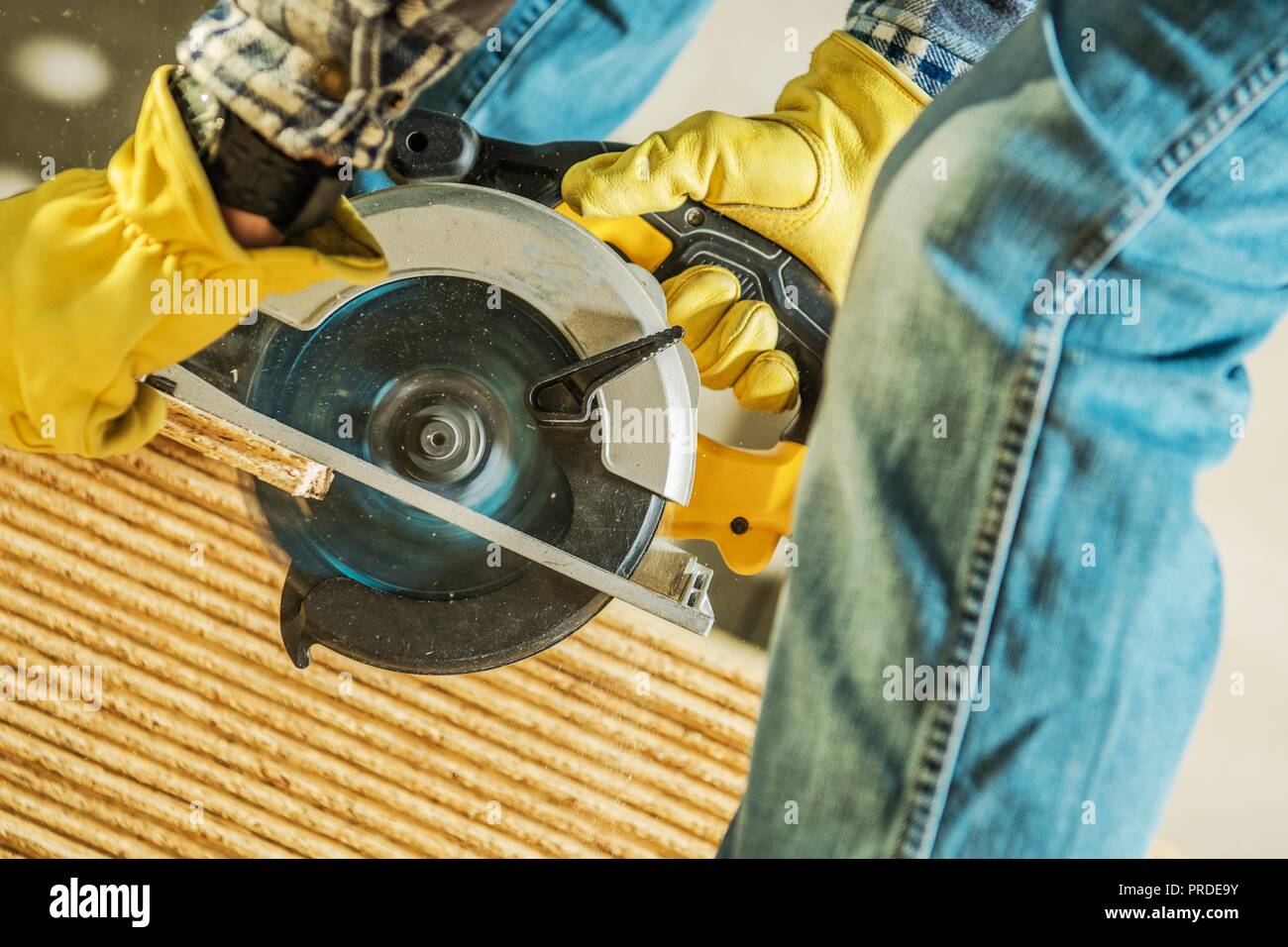 Construction Wood Work. Contractor Worker Cutting Plywood Using ...