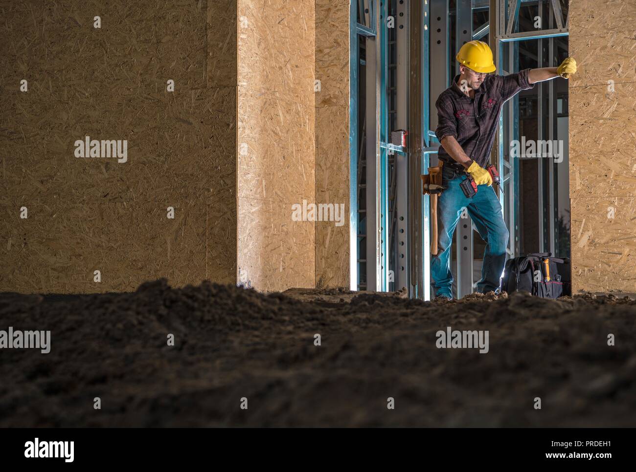 New House Building Worker. Caucasian Men Wearing Tools Belt in Front of ...