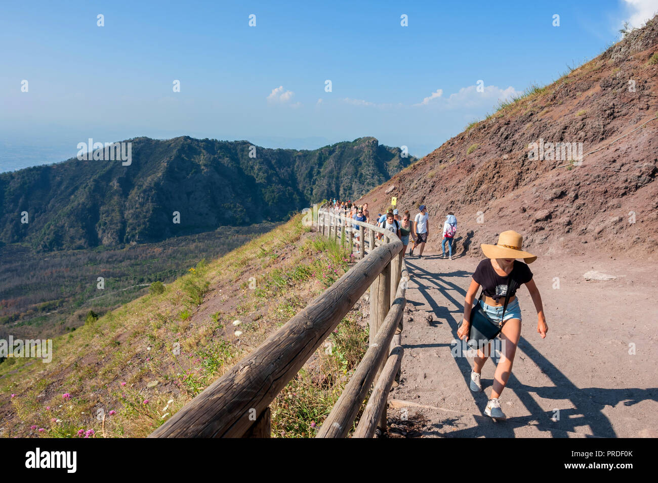MOUNT VESUVIUS, ITALY - AUGUST 1, 2018: Tourists walk around the crater ...