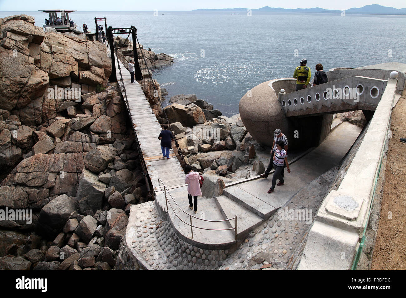 Tourists on a coastal walk at Chongjin in North Korea Stock Photo - Alamy