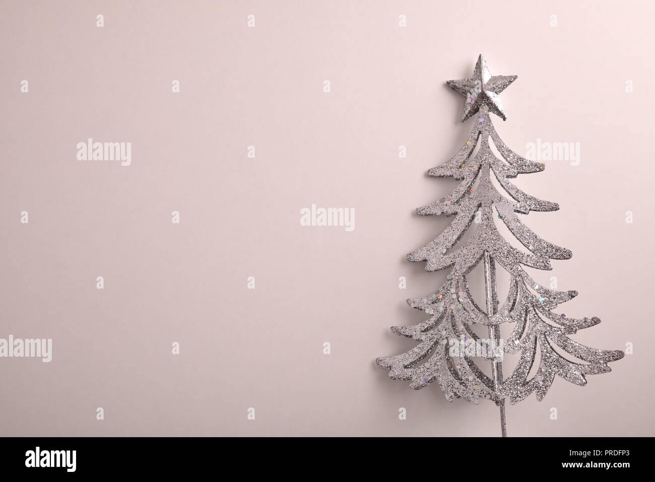 Christmas decoration silver tree with glitter on table and white ...