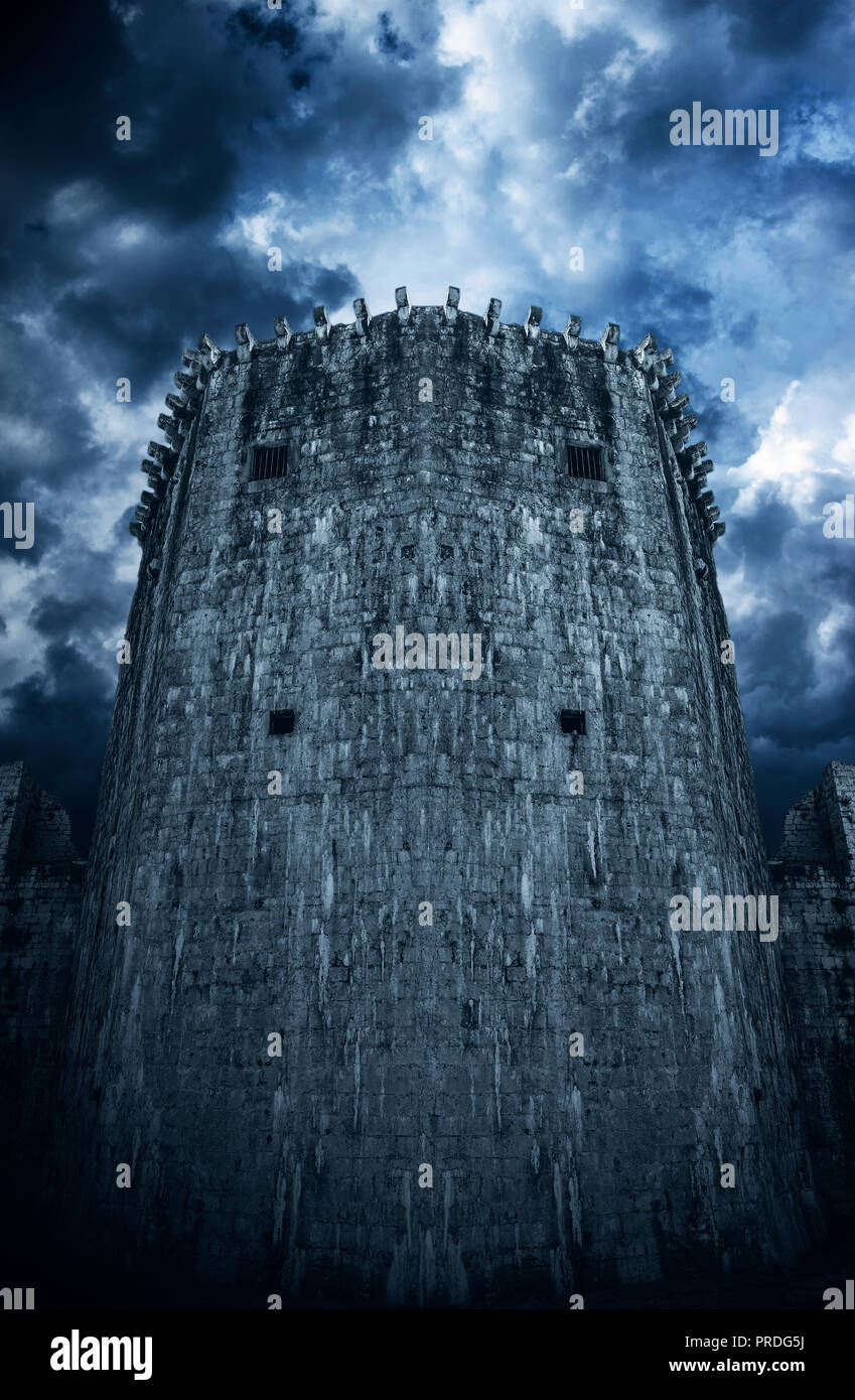 The tower of a medieval castle against a cloudy sky background Stock ...