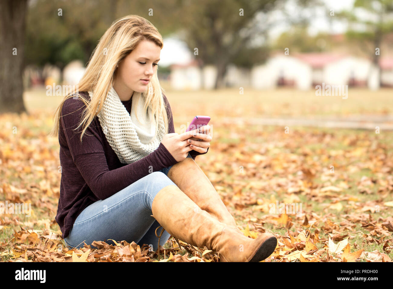 Woman sitting in beautiful autumn hi-res stock photography and images ...