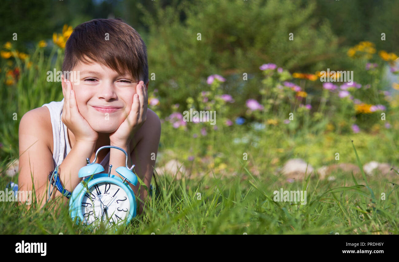 Boy holding clock hi-res stock photography and images - Alamy