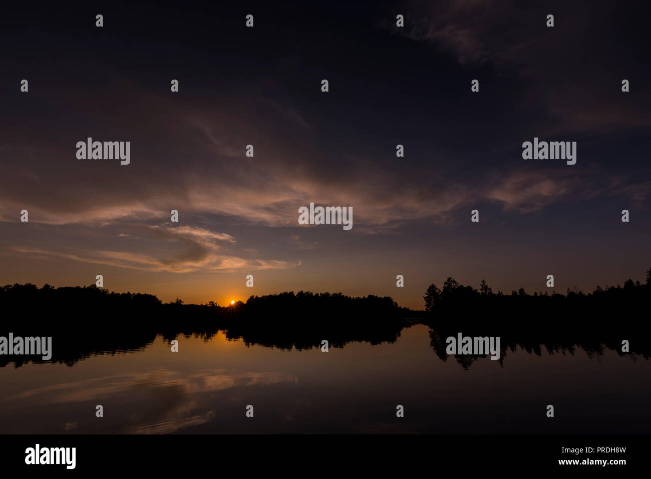 Post sunset glow on Spider Lake in Northern Wisconsin Stock Photo - Alamy