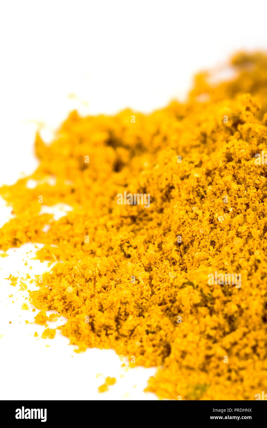 pile of yellow turmeric closeup on white Stock Photo - Alamy