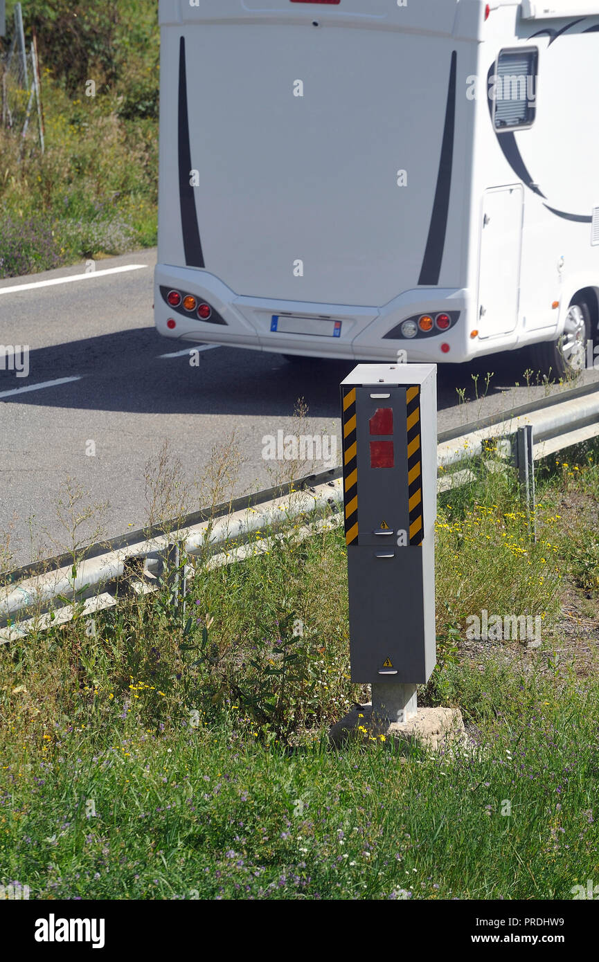 Automatic speed control radar on a French road with a motorhome passing ...