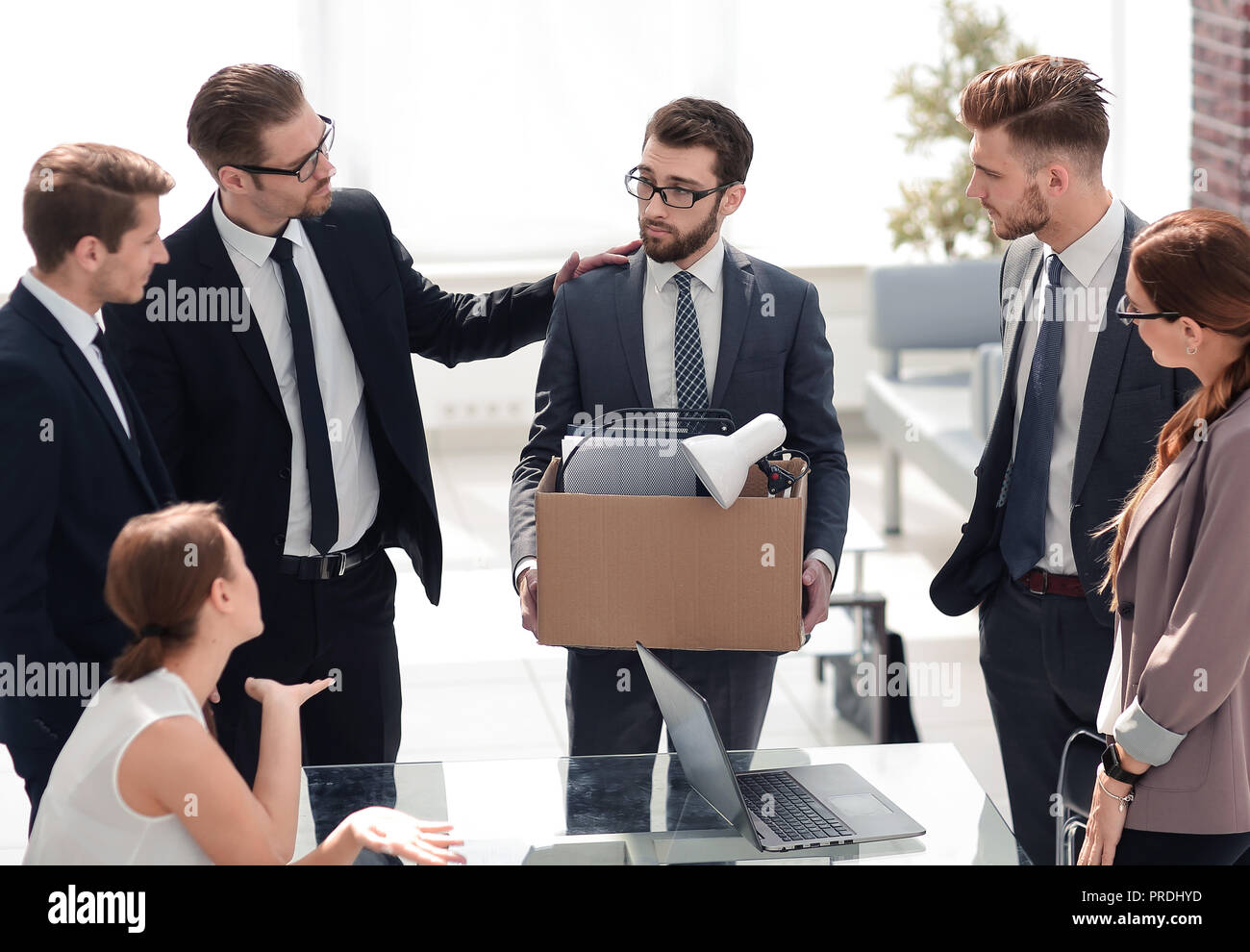 business team and frustrated employee with personal things Stock Photo ...