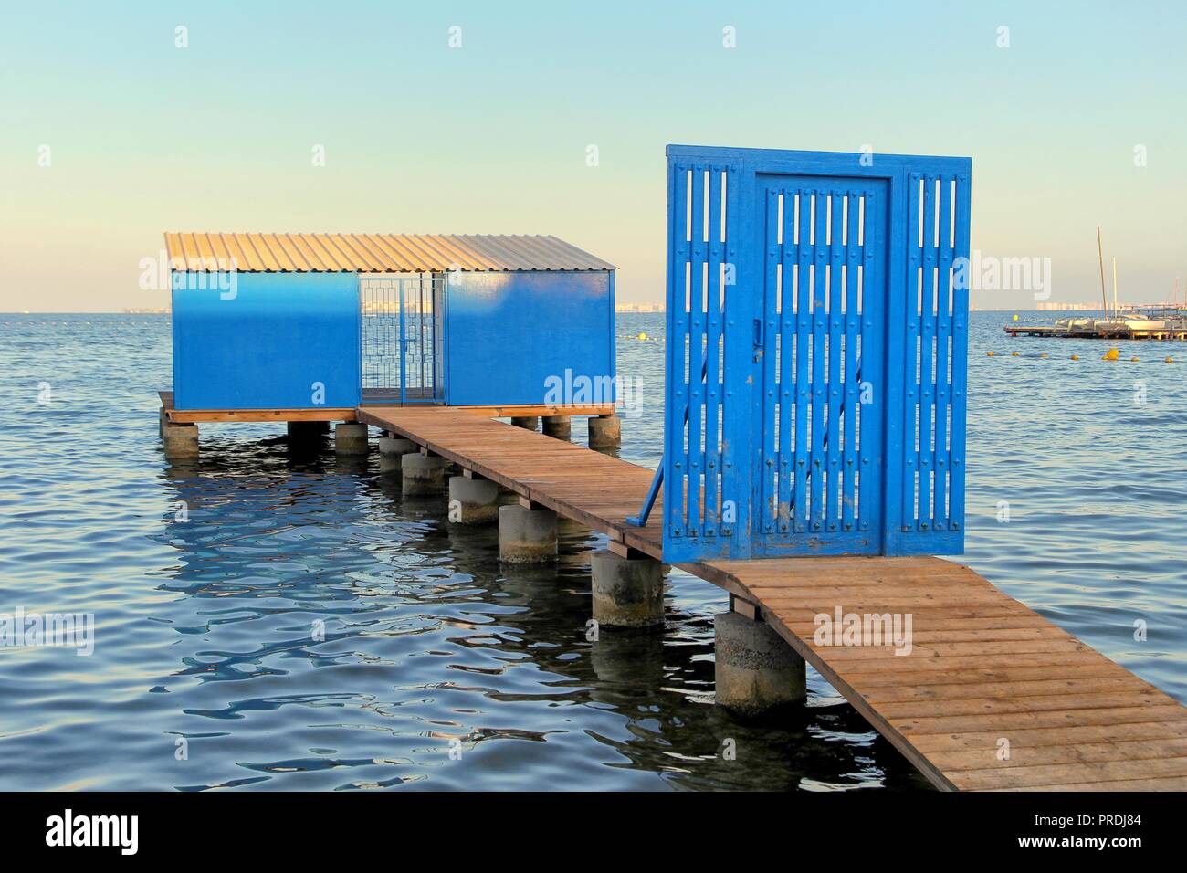 Lovely warm evening image of a blue gate barring the way to a private ...