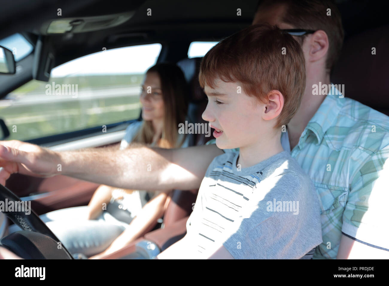 Father teaching son to drive car hi-res stock photography and images ...
