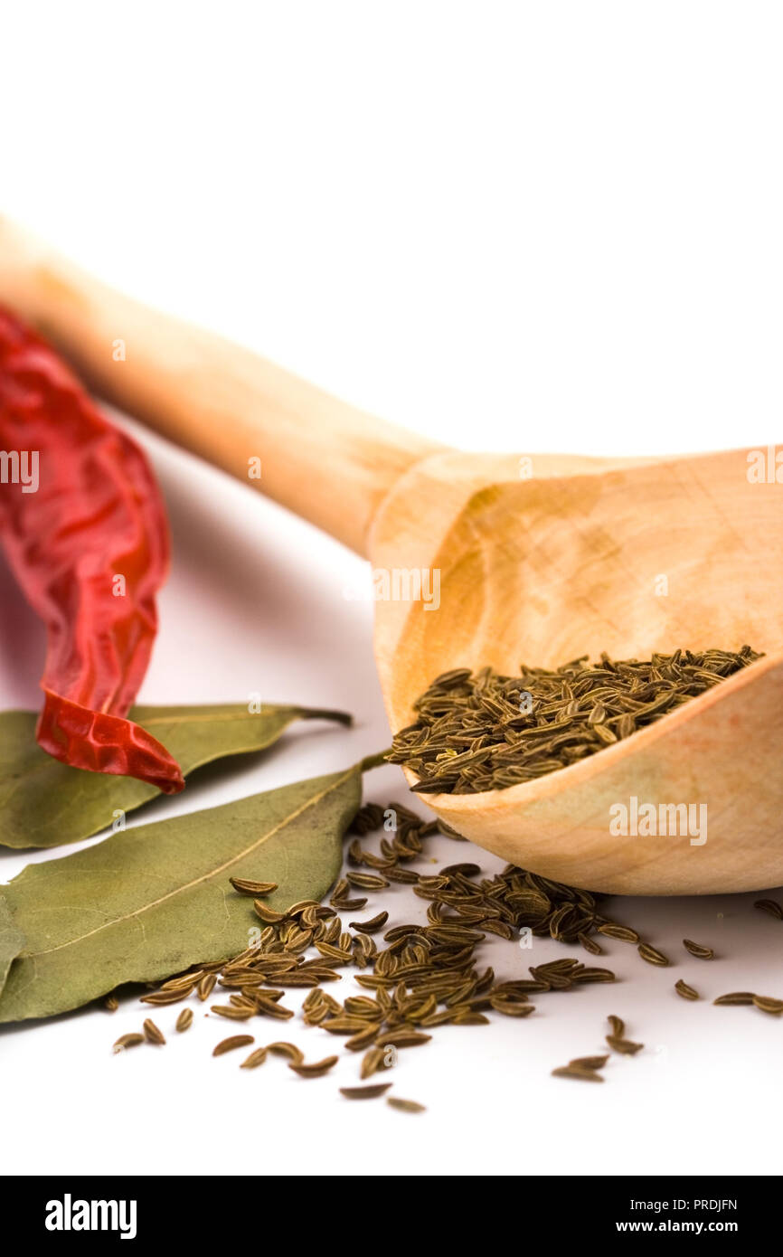 spices: pimento, caraway and bay leaves closeup on white background ...