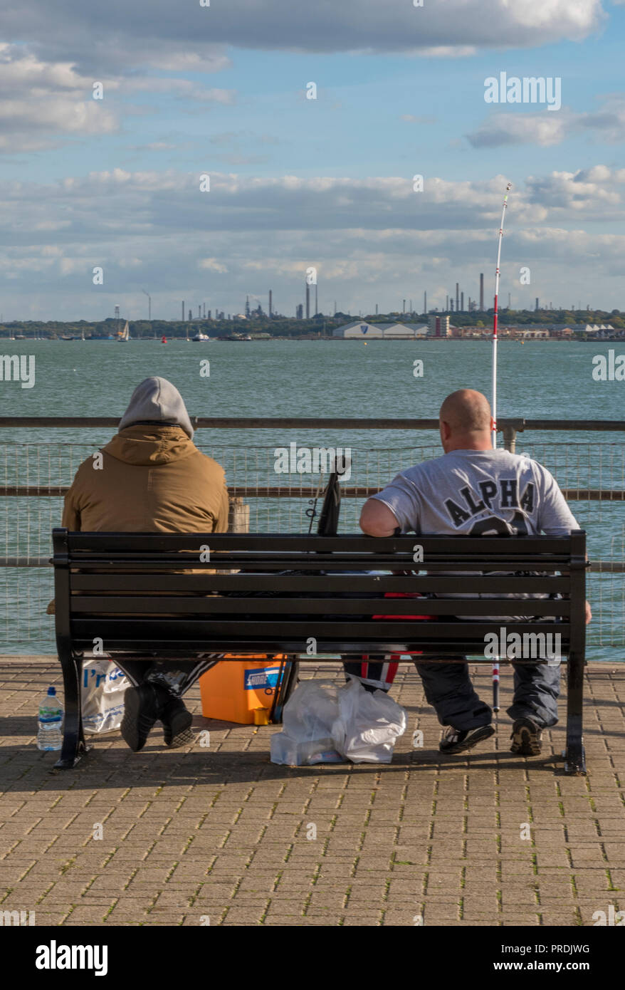 Two men sitting on bench chatting hi-res stock photography and images ...