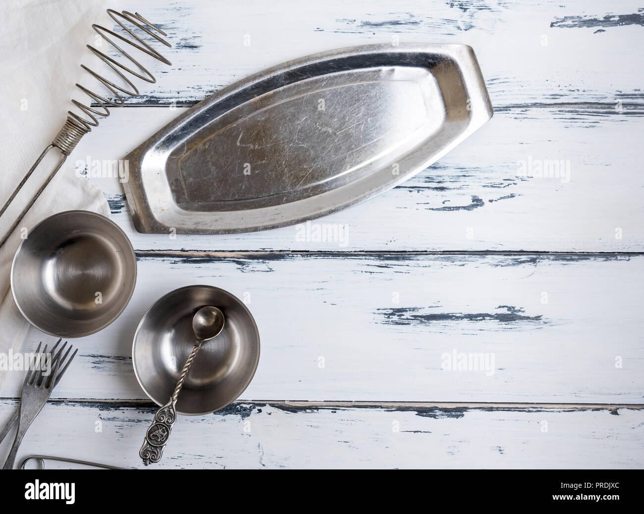 kitchen empty metal objects on a white wooden background, empty space ...