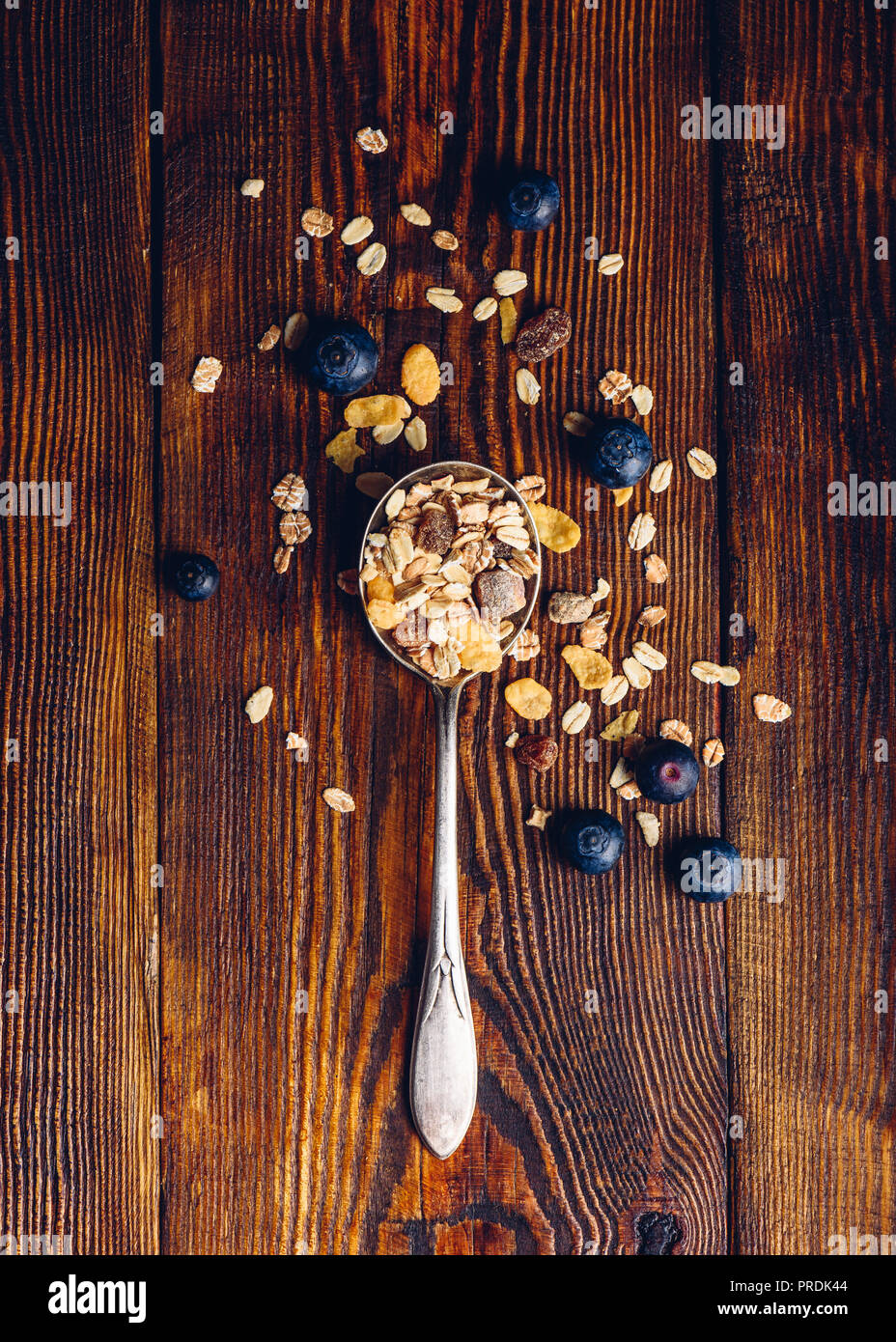 Spoonful of Granola and Scattered Blueberry on Wooden Table. View from ...