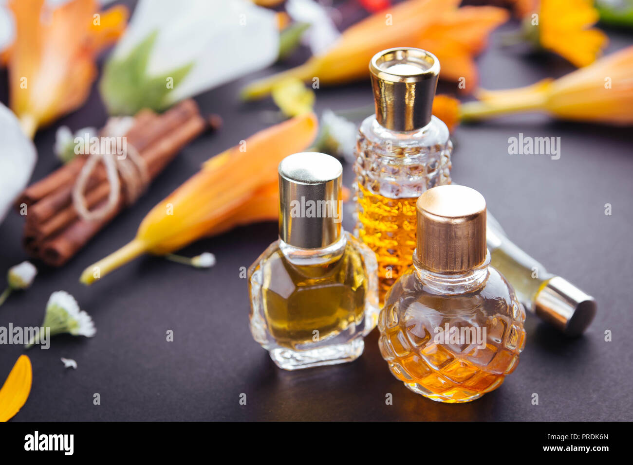 Bottles of perfume with ingredients on paper Stock Photo - Alamy