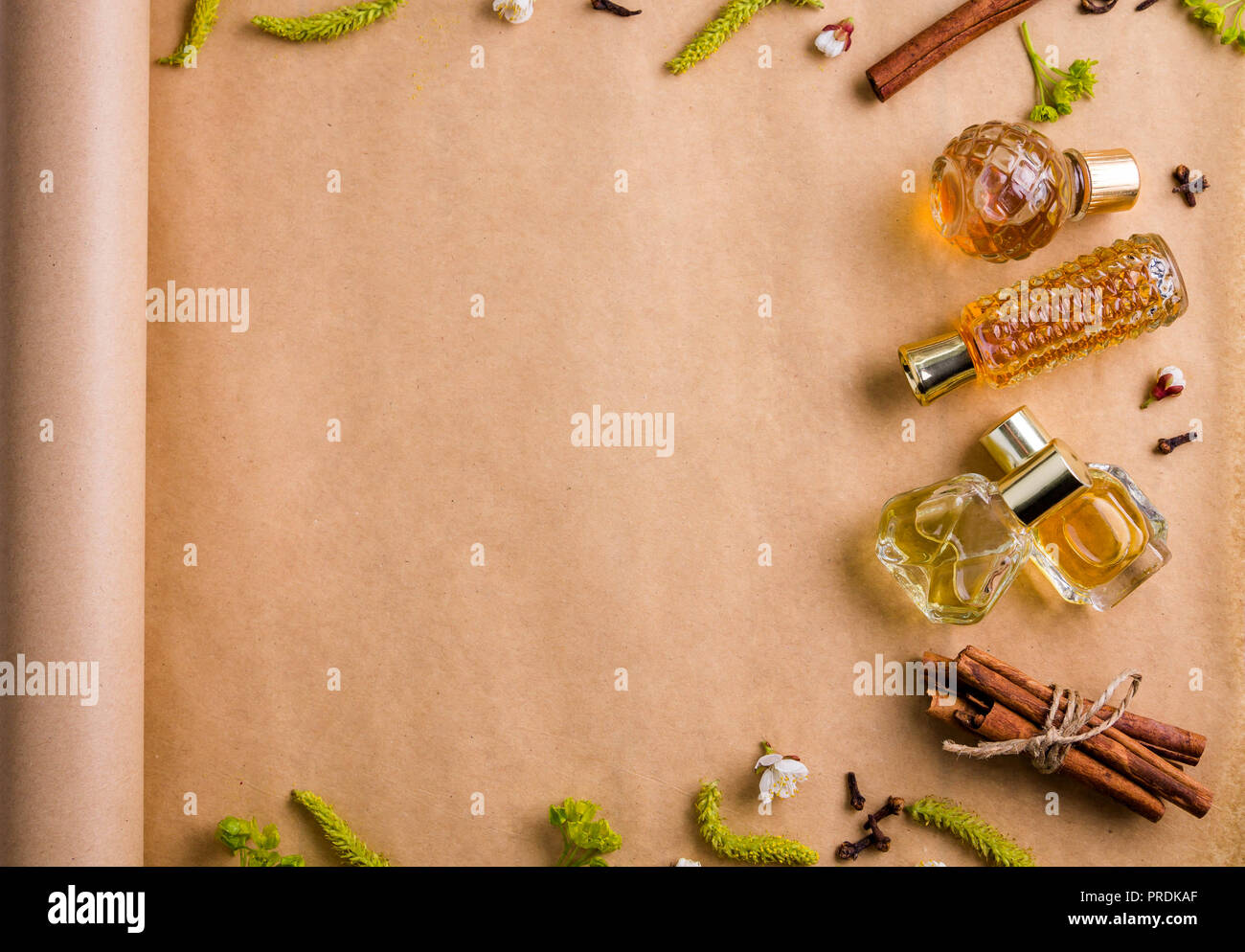 Bottles of perfume with ingredients on paper Stock Photo - Alamy