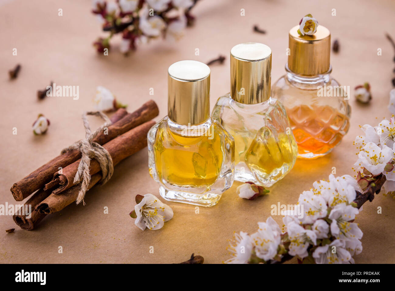 Bottles of perfume with ingredients on paper Stock Photo - Alamy