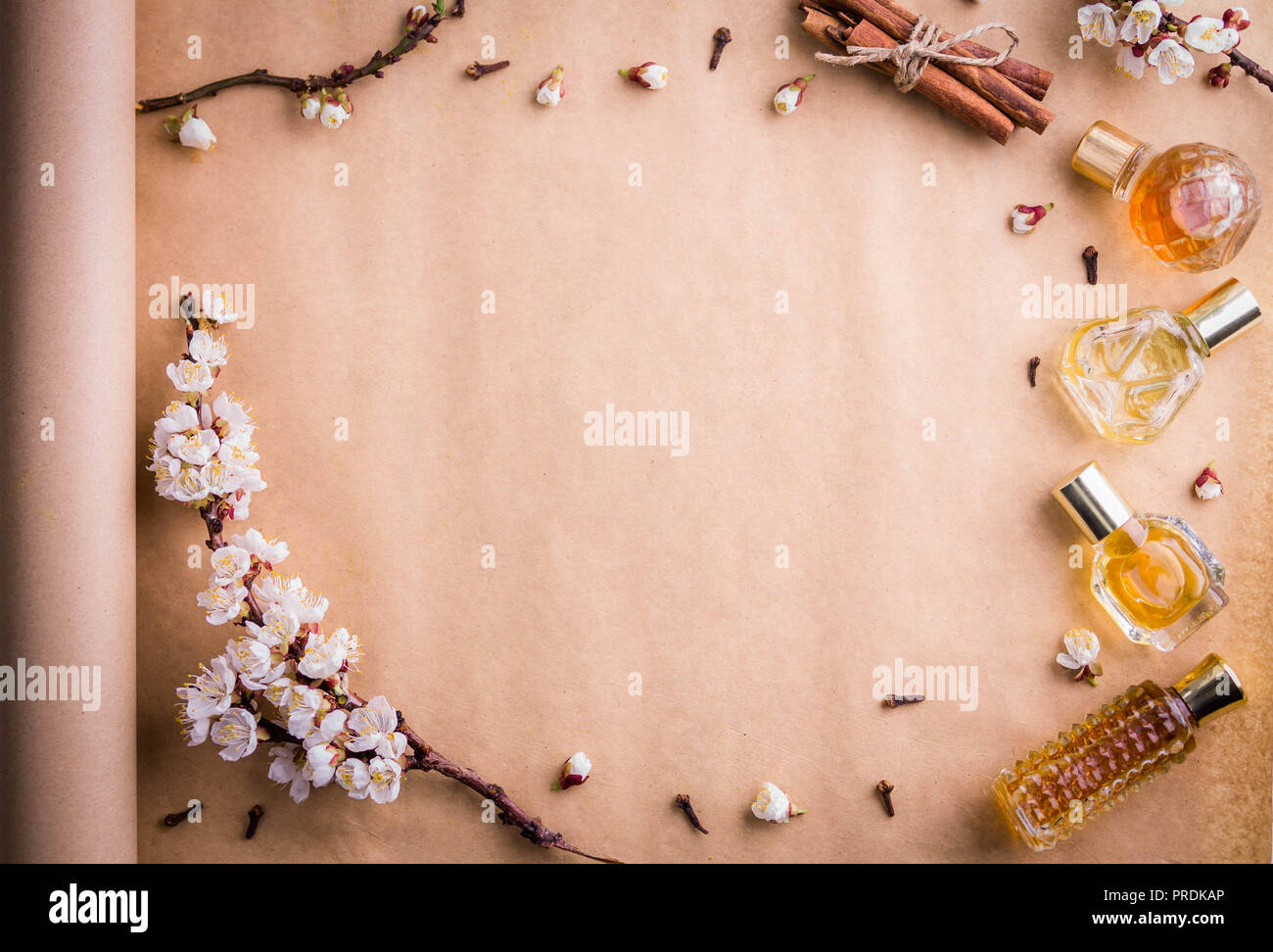 Bottles of perfume with ingredients on paper Stock Photo - Alamy