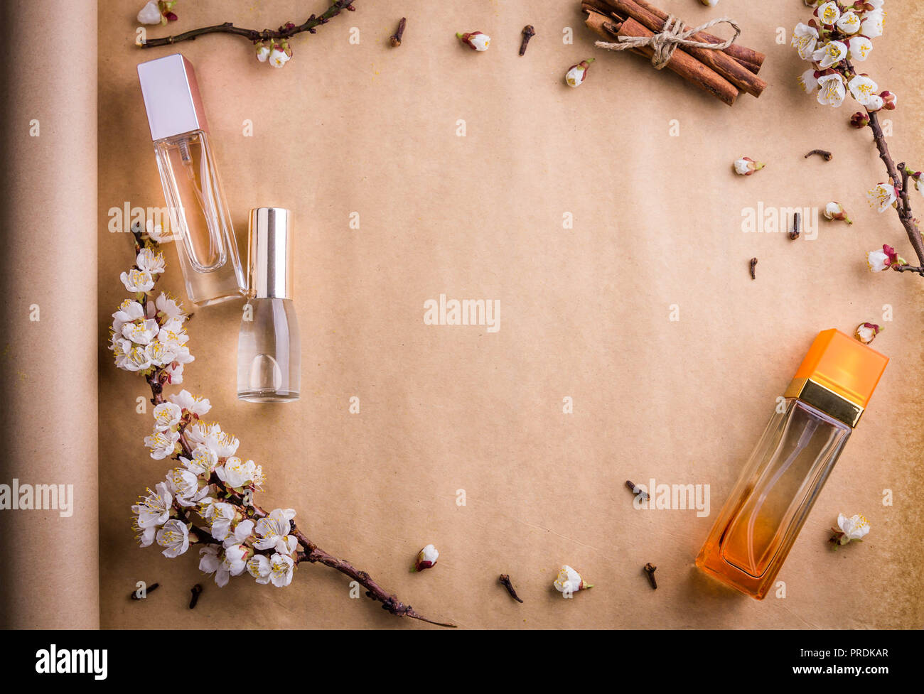 Bottles of perfume with ingredients on paper Stock Photo - Alamy