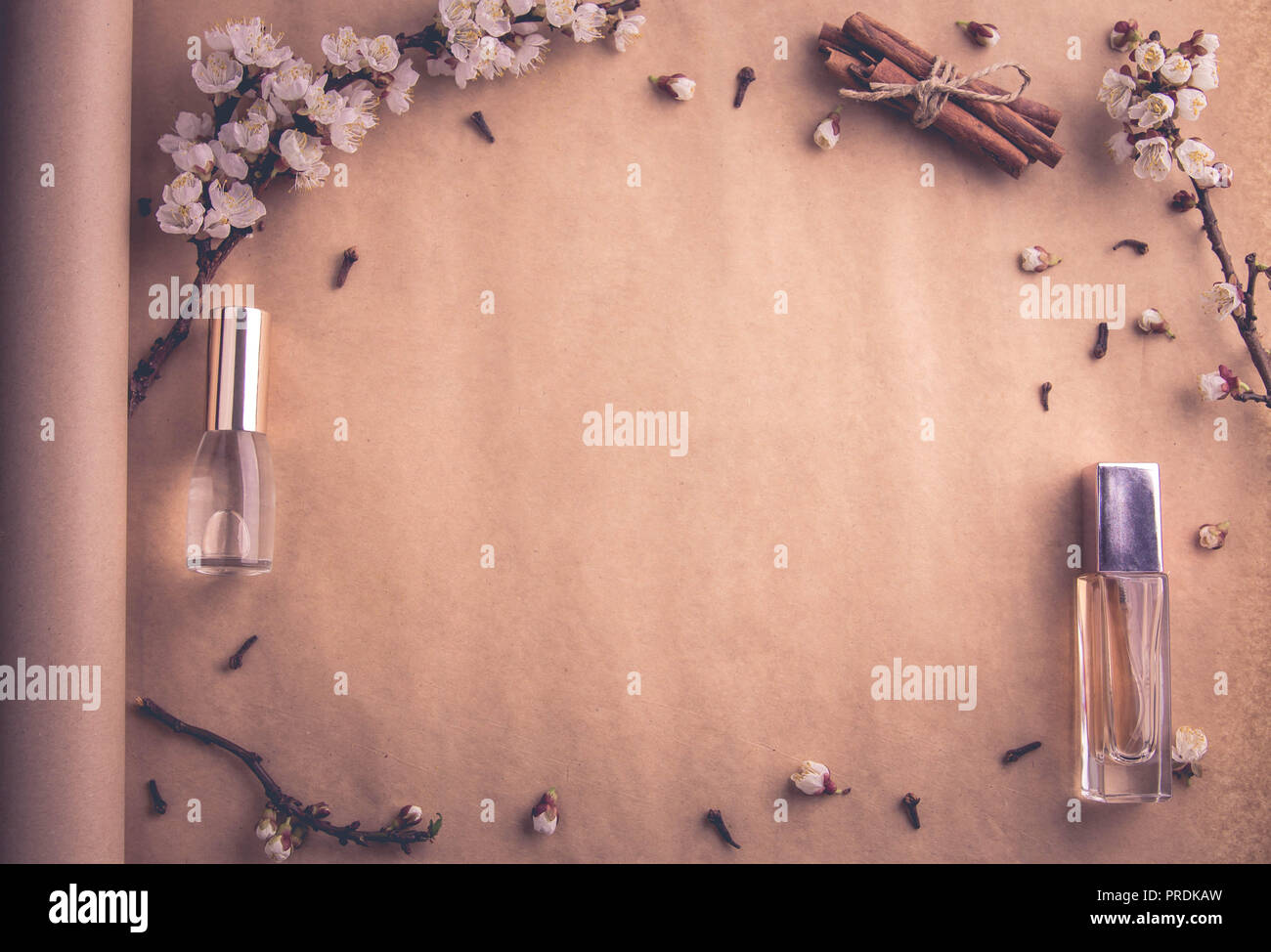 Bottles of perfume with ingredients on paper Stock Photo - Alamy