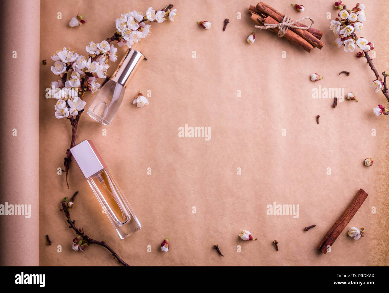 Bottles of perfume with ingredients on paper Stock Photo - Alamy