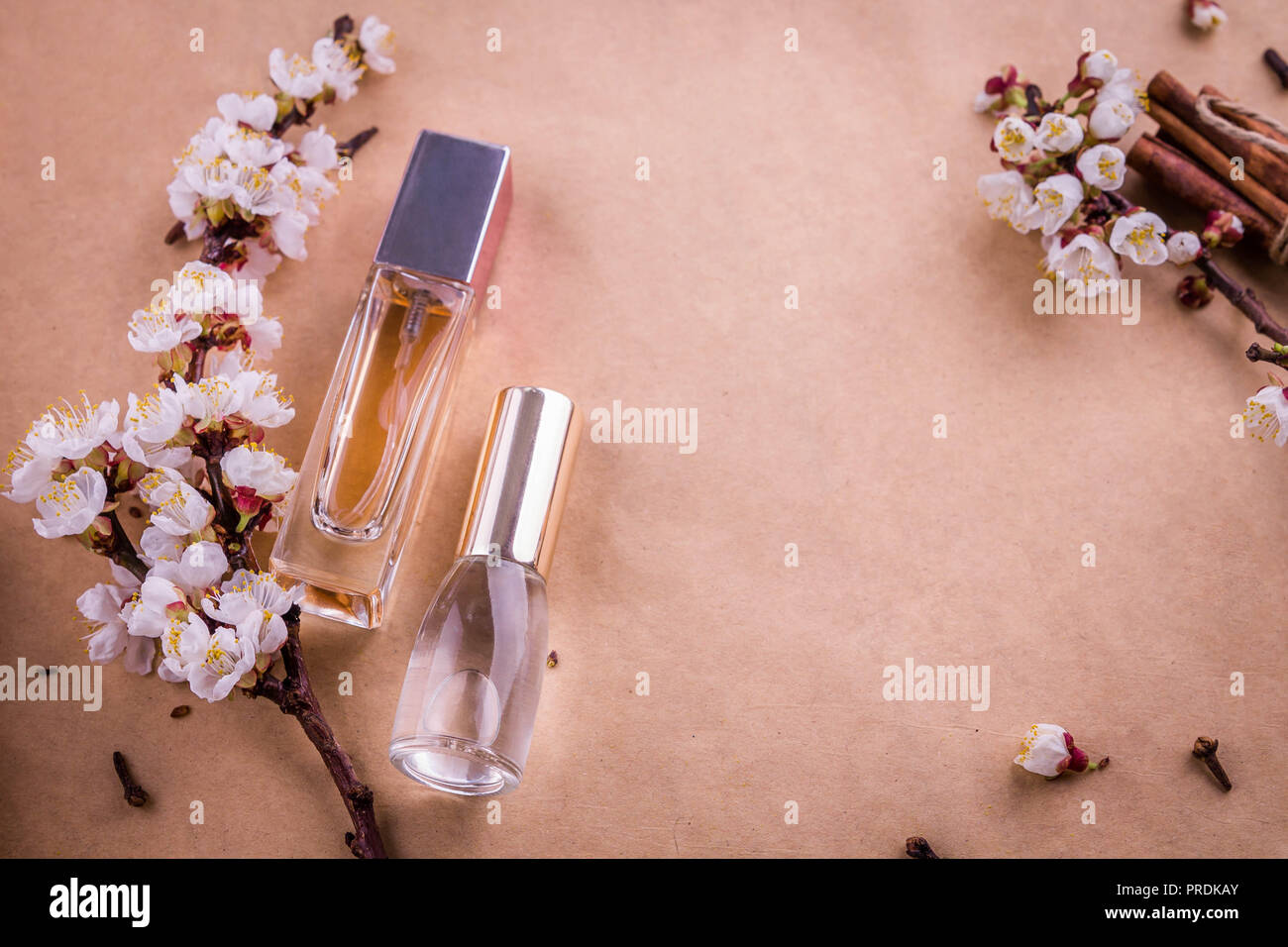 Bottles of perfume with ingredients on paper Stock Photo - Alamy