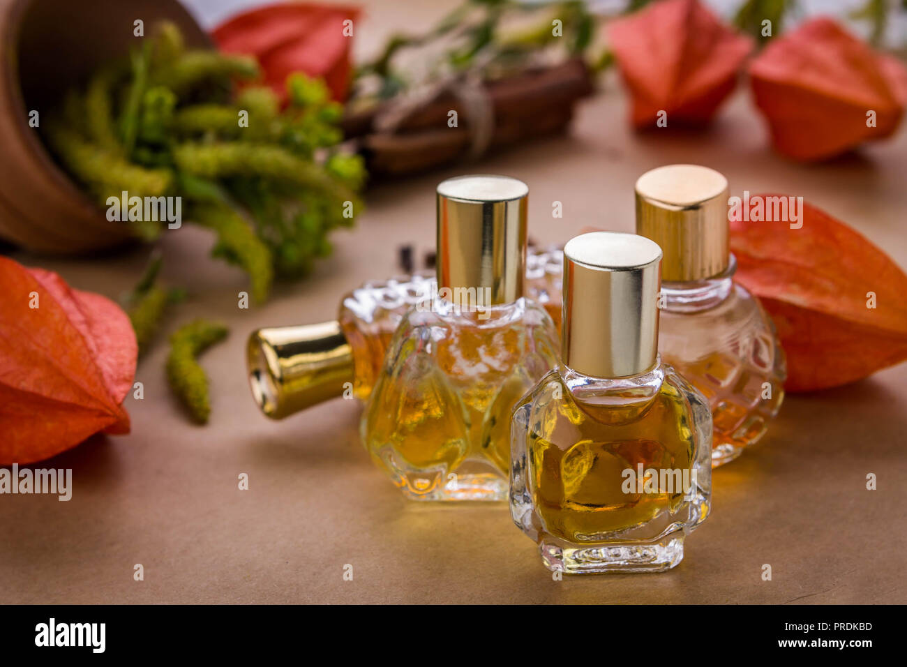 Bottles of perfume with ingredients on paper Stock Photo - Alamy