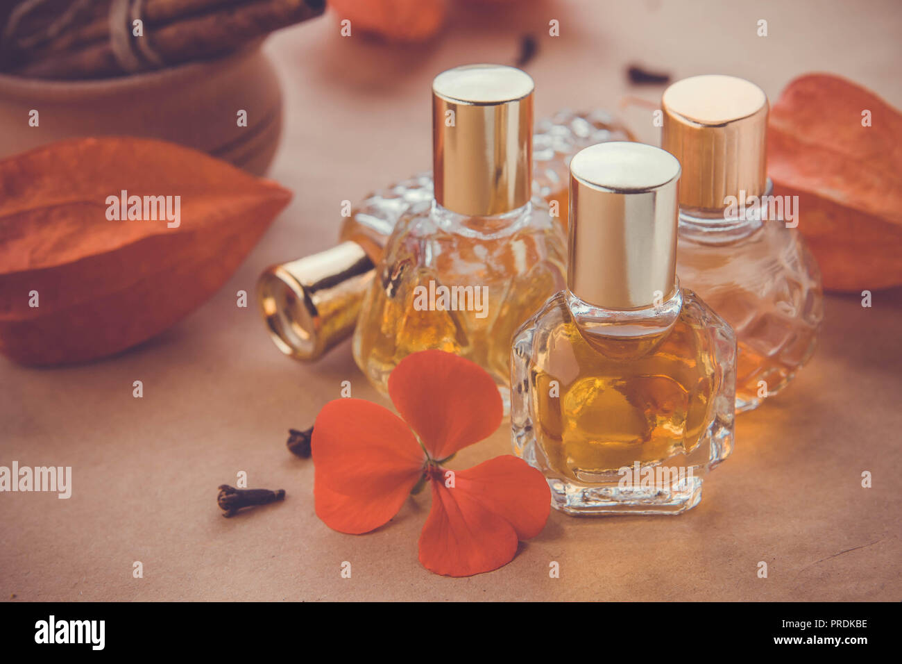 Bottles of perfume with ingredients on paper Stock Photo - Alamy