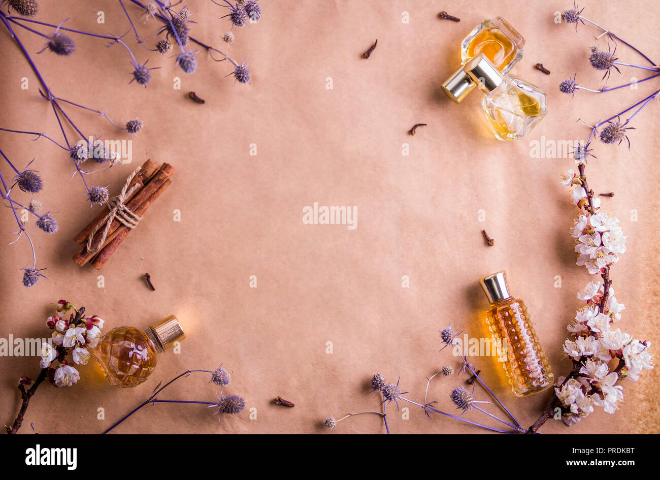 Bottles of perfume with ingredients on paper Stock Photo - Alamy