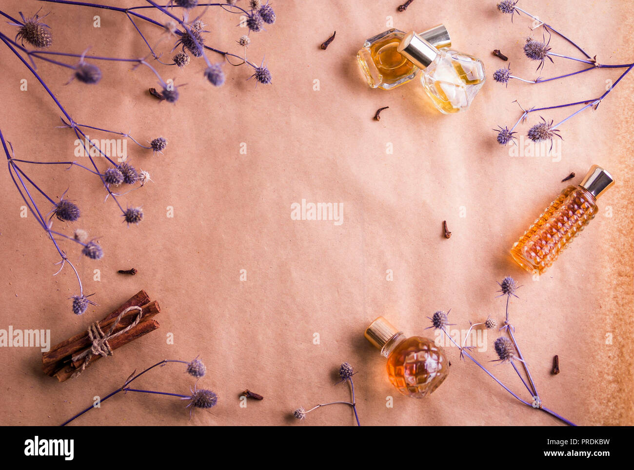 Bottles of perfume with ingredients on paper Stock Photo - Alamy