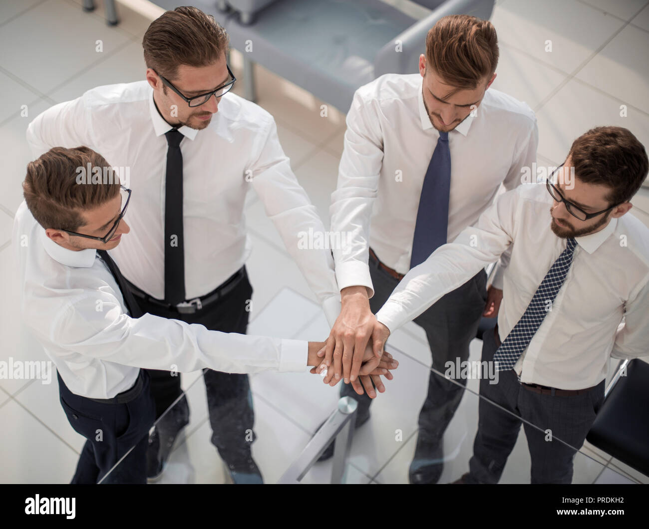 top view.a group of employees showing their unity Stock Photo - Alamy