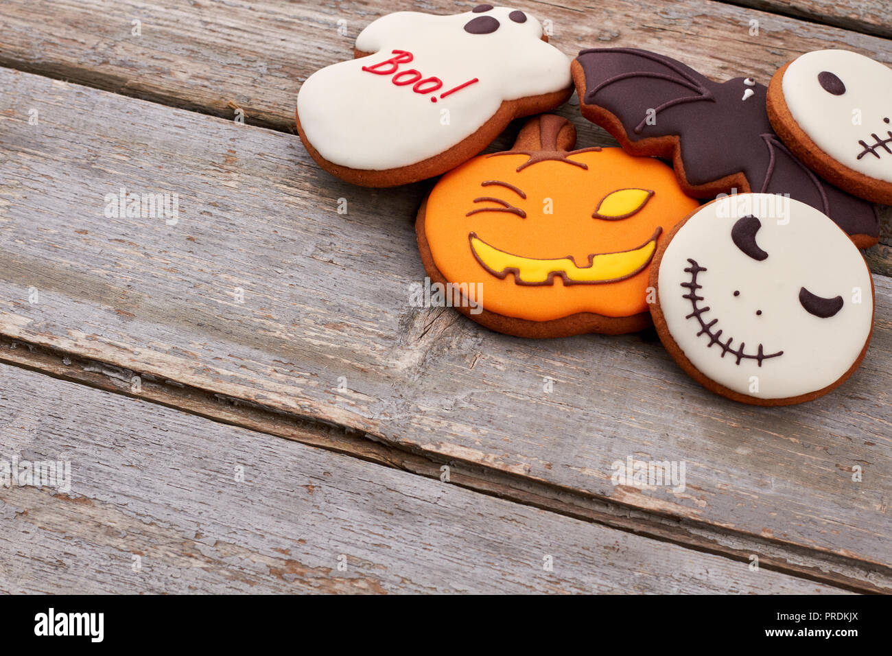 Halloween gingerbread cookies on wooden background Stock Photo - Alamy