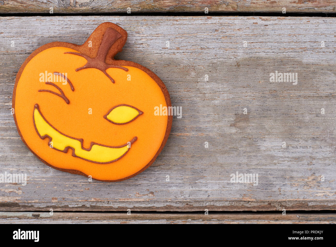 Halloween gingerbread cookie on wooden background Stock Photo - Alamy